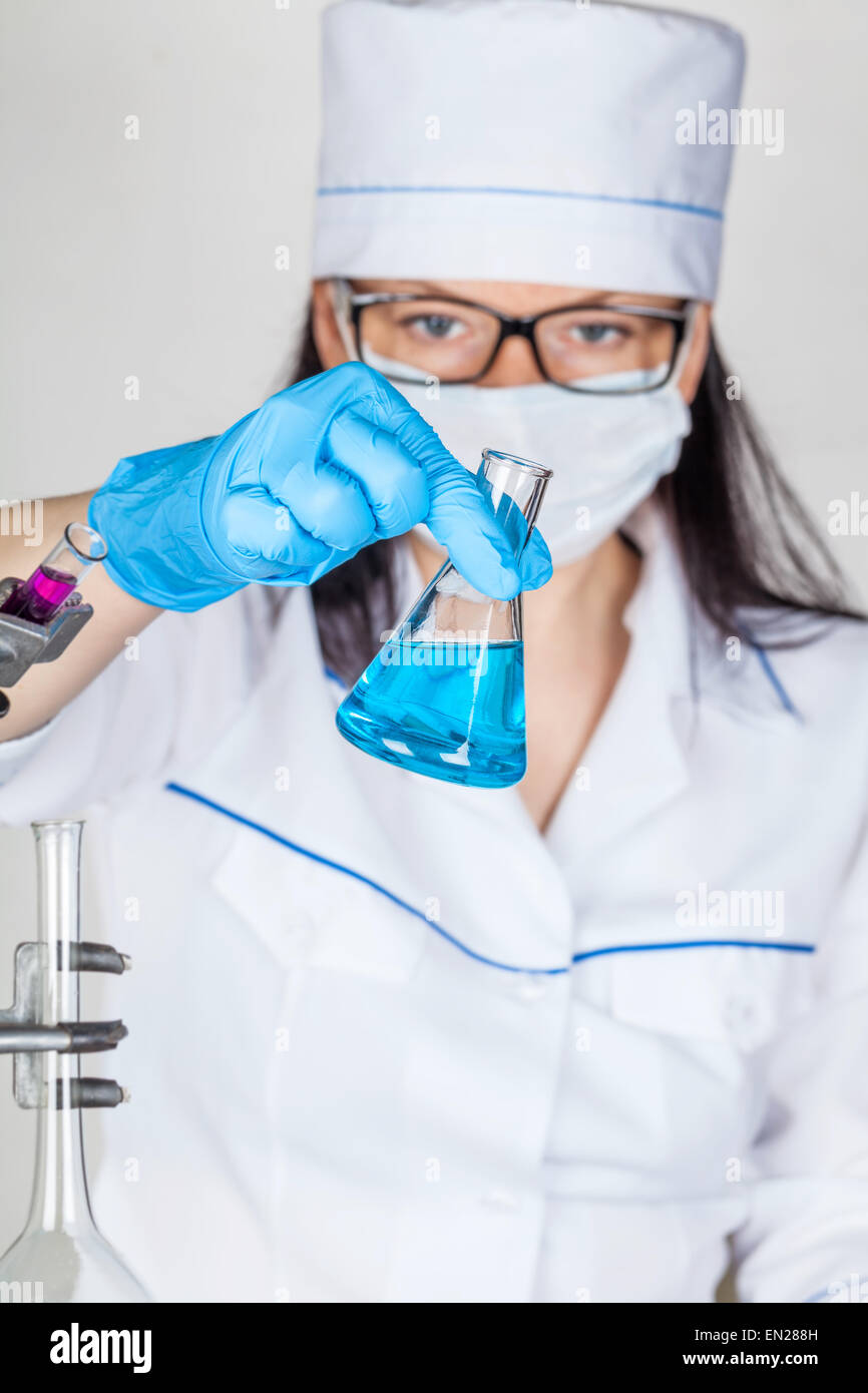 laboratorian conducting experiments closeup on a light background Stock ...