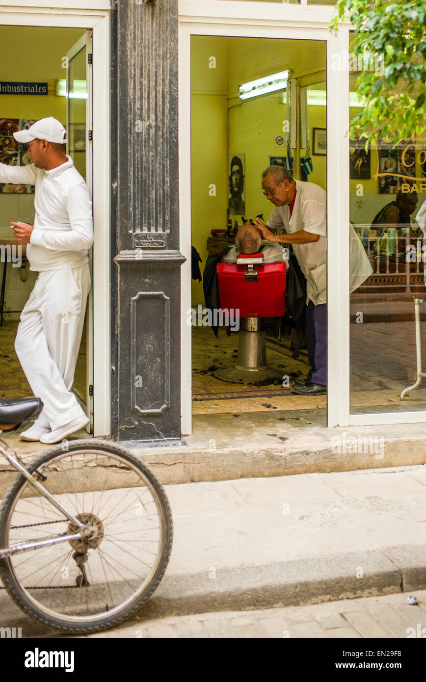 Barber shaving customer in his shop in old Havana, Cuba Stock Photo - Alamy