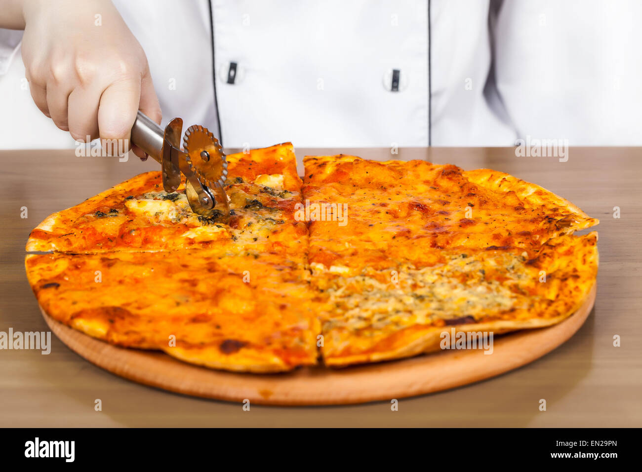 Chef cuts pizza knife hi-res stock photography and images - Alamy