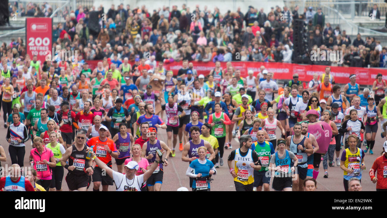 London, UK. 26 April 2015. Crowds of runners and helpers on the Mall ...
