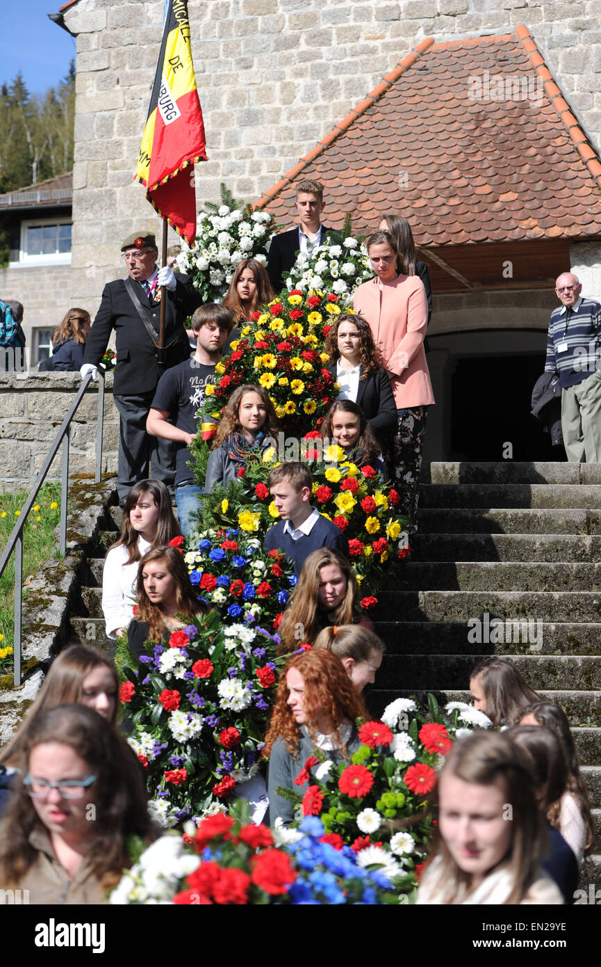 Flossenbuerg, Germany. 26th Apr, 2015. Visitors go to a wreath laying ...
