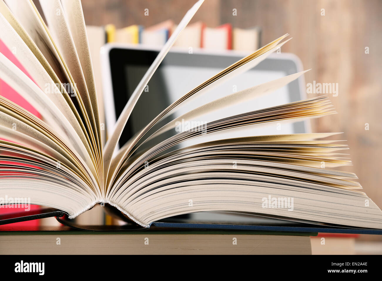 Composition with books and tablet computer on the table Stock Photo - Alamy