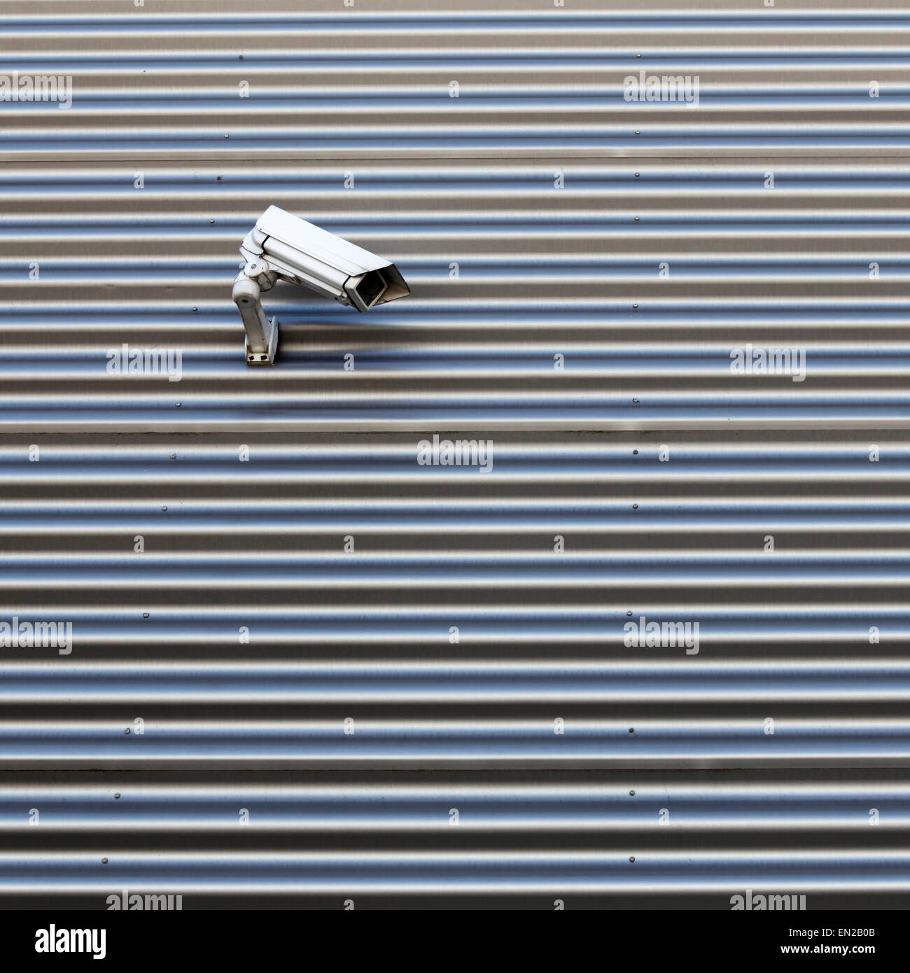 camera on wall of corrugated iron industrial building Stock Photo - Alamy