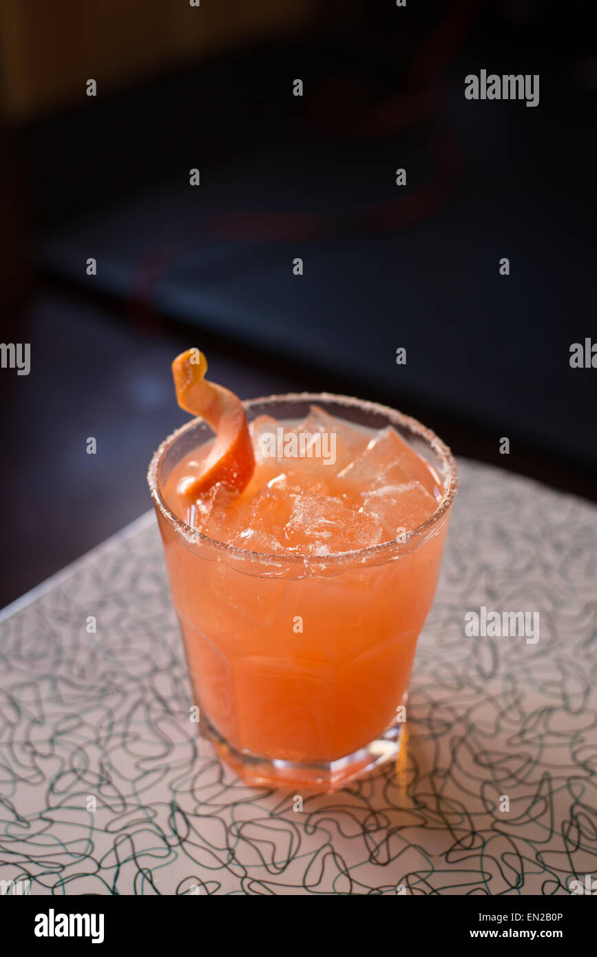 Grapefruit and gin cocktail with grapefruit twist garnish Stock Photo ...