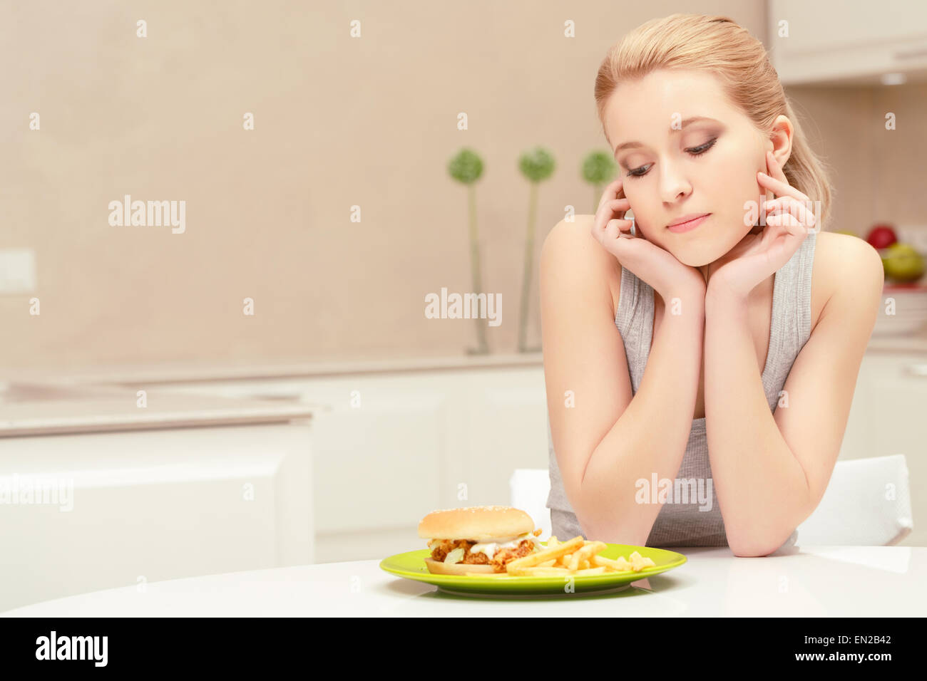 Young woman and fast-food lunch Stock Photo - Alamy