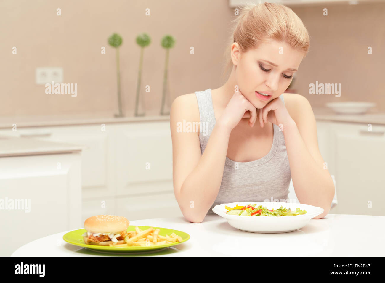 Young woman choosing lunch Stock Photo - Alamy