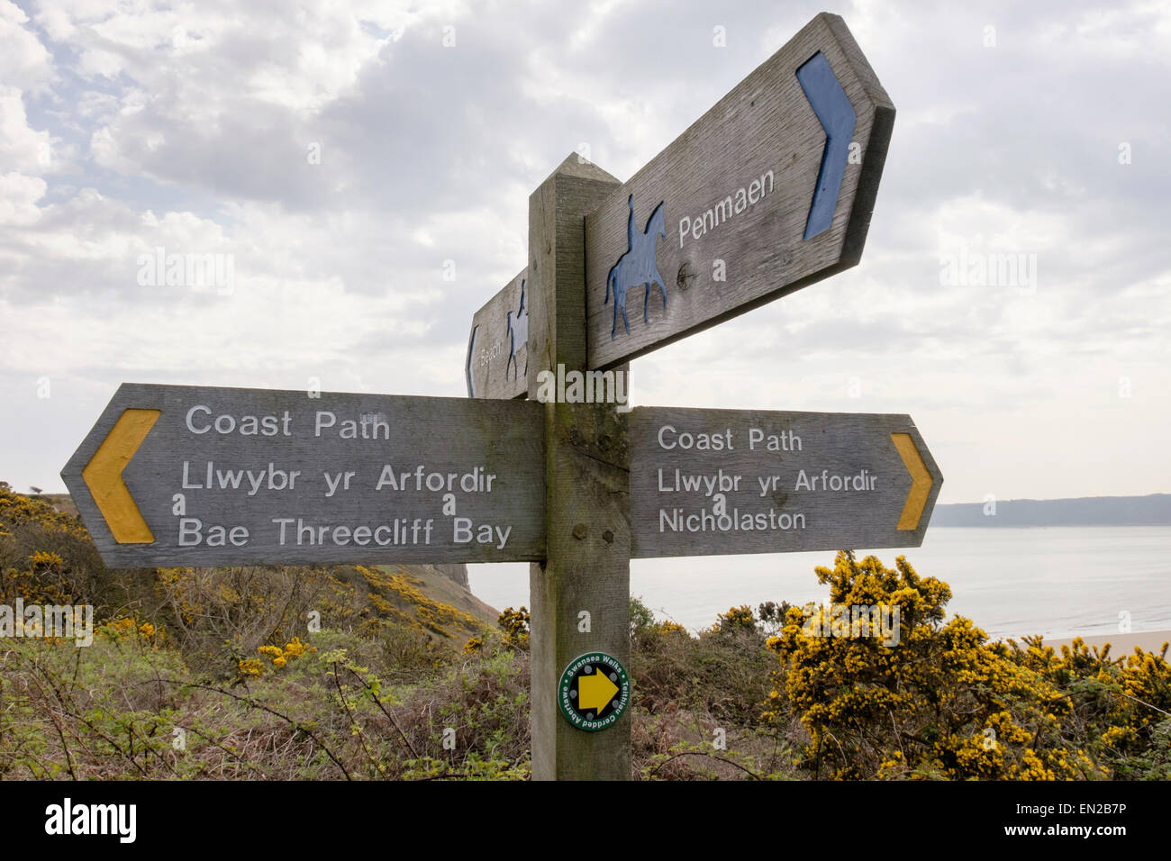 Wales Coast Path signpost and bridleway signs on Gower Peninsula ...