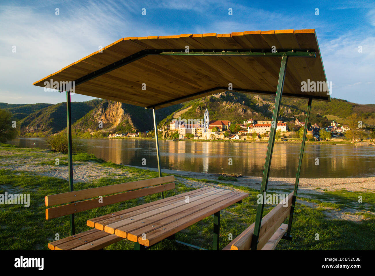 Outlook over a bench to a old town in Austria Stock Photo - Alamy