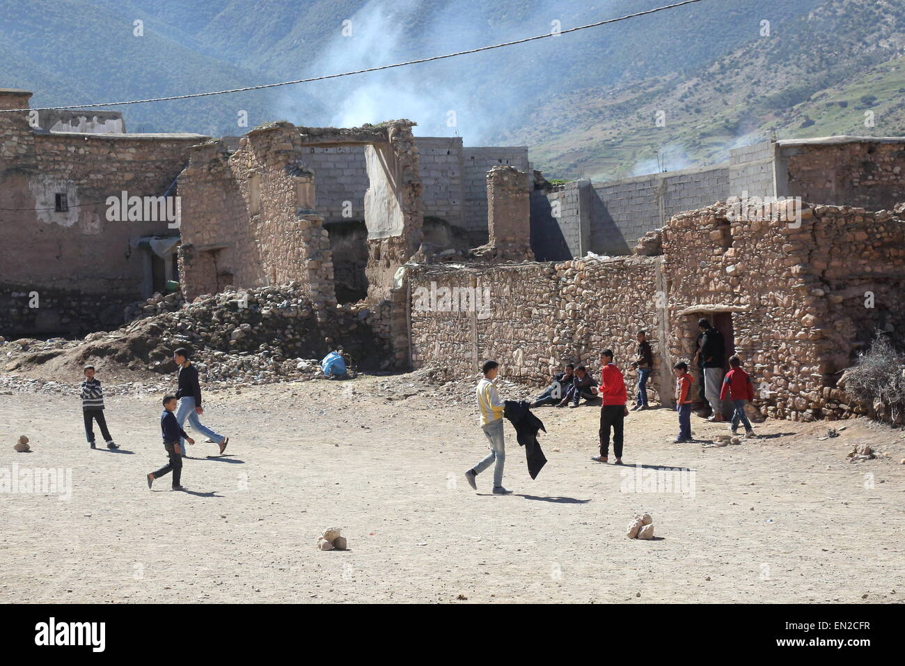 Kids playing football on the streets of the Berber village of Tafgart ...