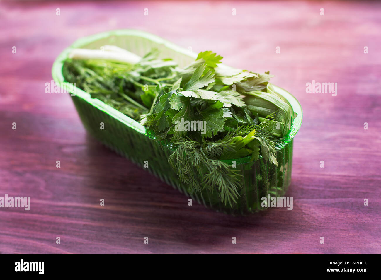 Fresh herbs in a transparent plastic container Stock Photo - Alamy