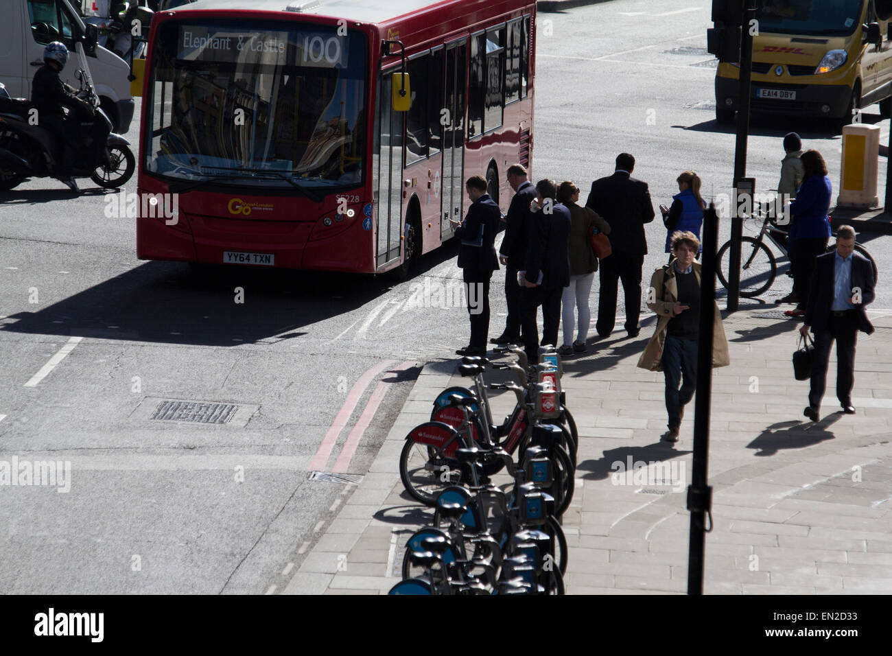 Transport in London Commuters cross busy street in Central London with ...