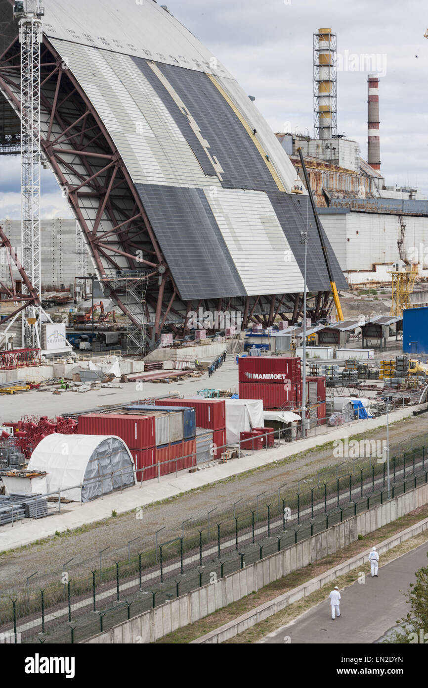 Chernobyl, Ukraine. 29th Aug, 2014. Two workers walking under the ...
