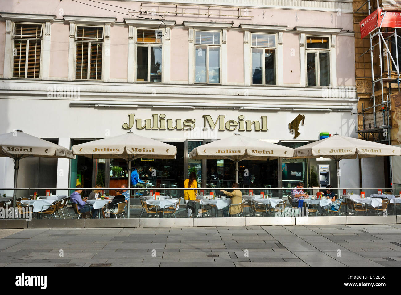 The exterior of Julius Meinl restaurant with customers under large ...