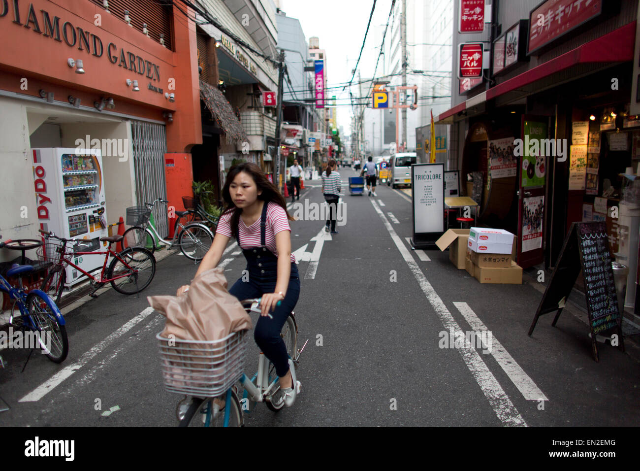 Japanese girl on bicycle hi-res stock photography and images - Alamy