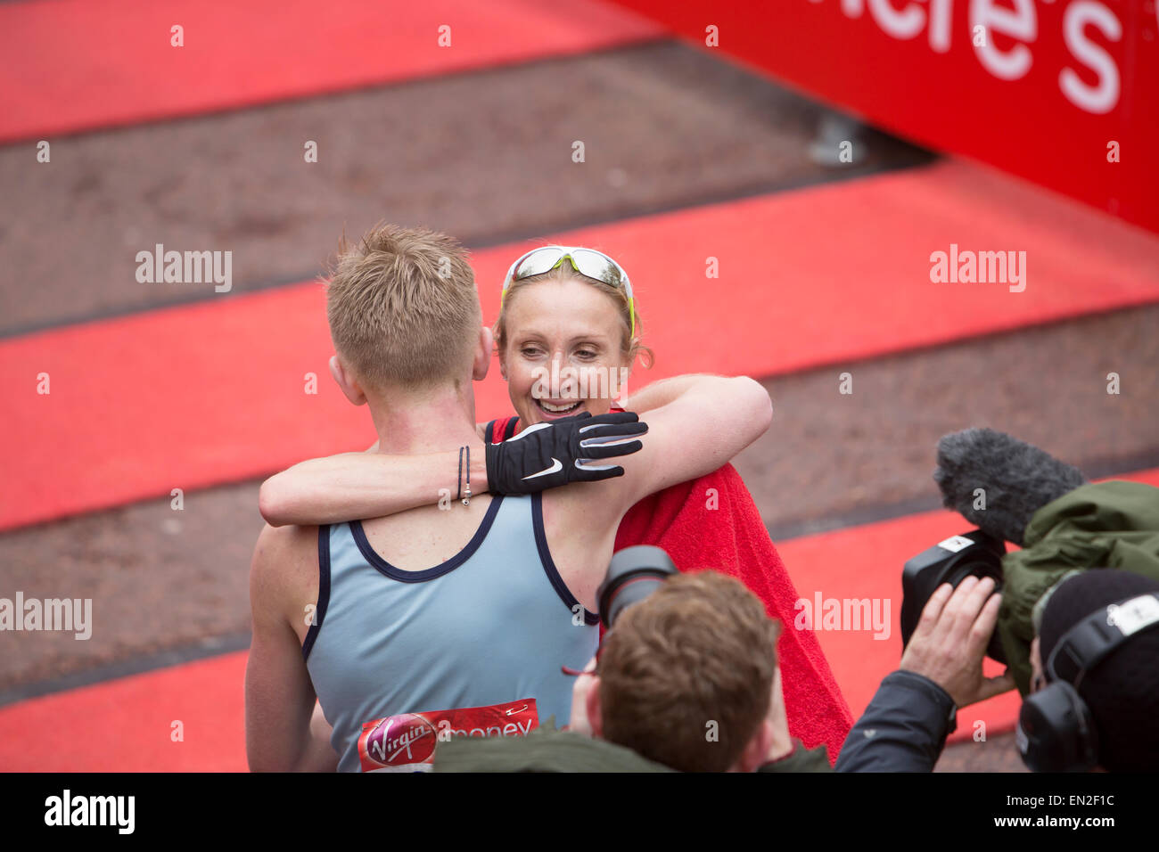 Paula Radcliffe hugs a fellow runner at the Virgin money London ...