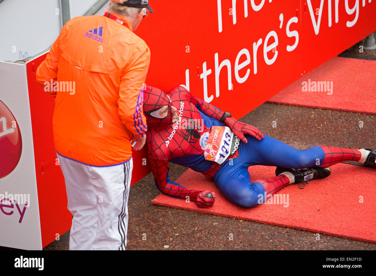 Spiderman collapses at the finish line of the Virgin money London ...
