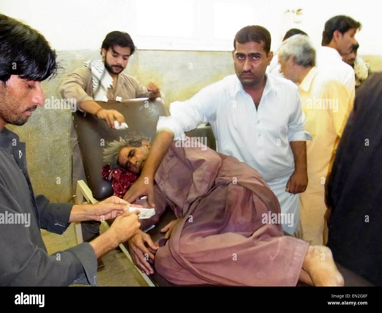Sibi, Pakistan. 26th Apr, 2015. An injured man receives medical ...