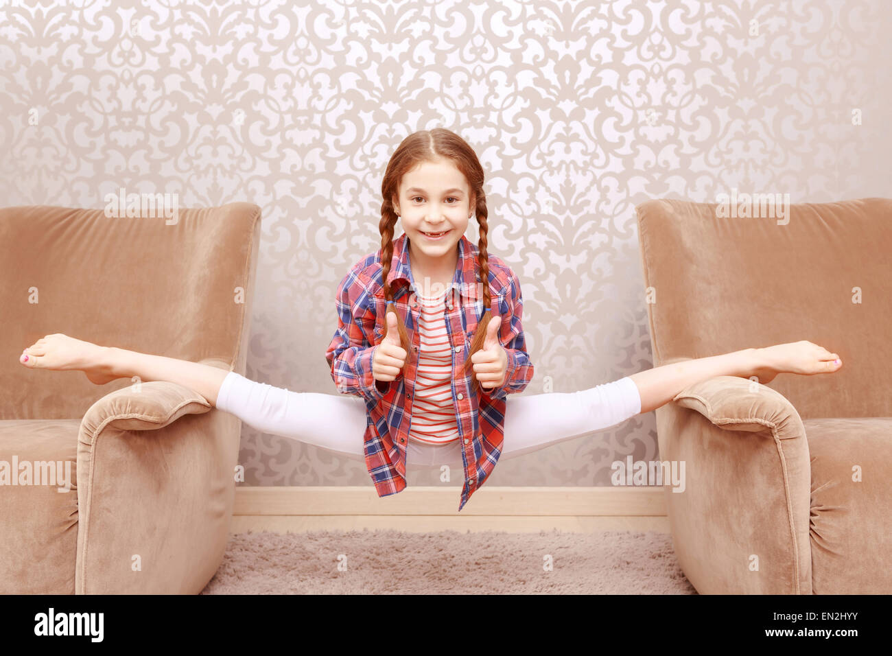 Little flexible girl splitting legs apart Stock Photo - Alamy