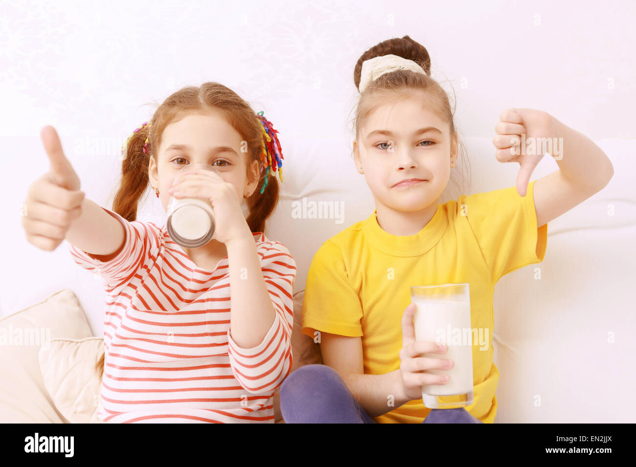 Two cute kids judging milk Stock Photo - Alamy