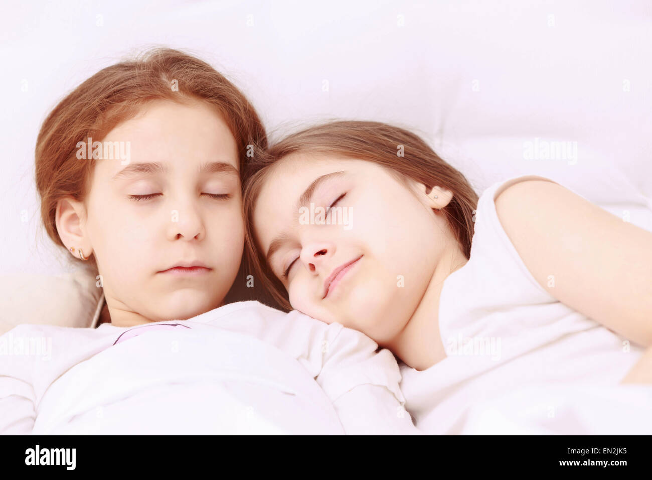 Two little cute sleeping girls Stock Photo - Alamy
