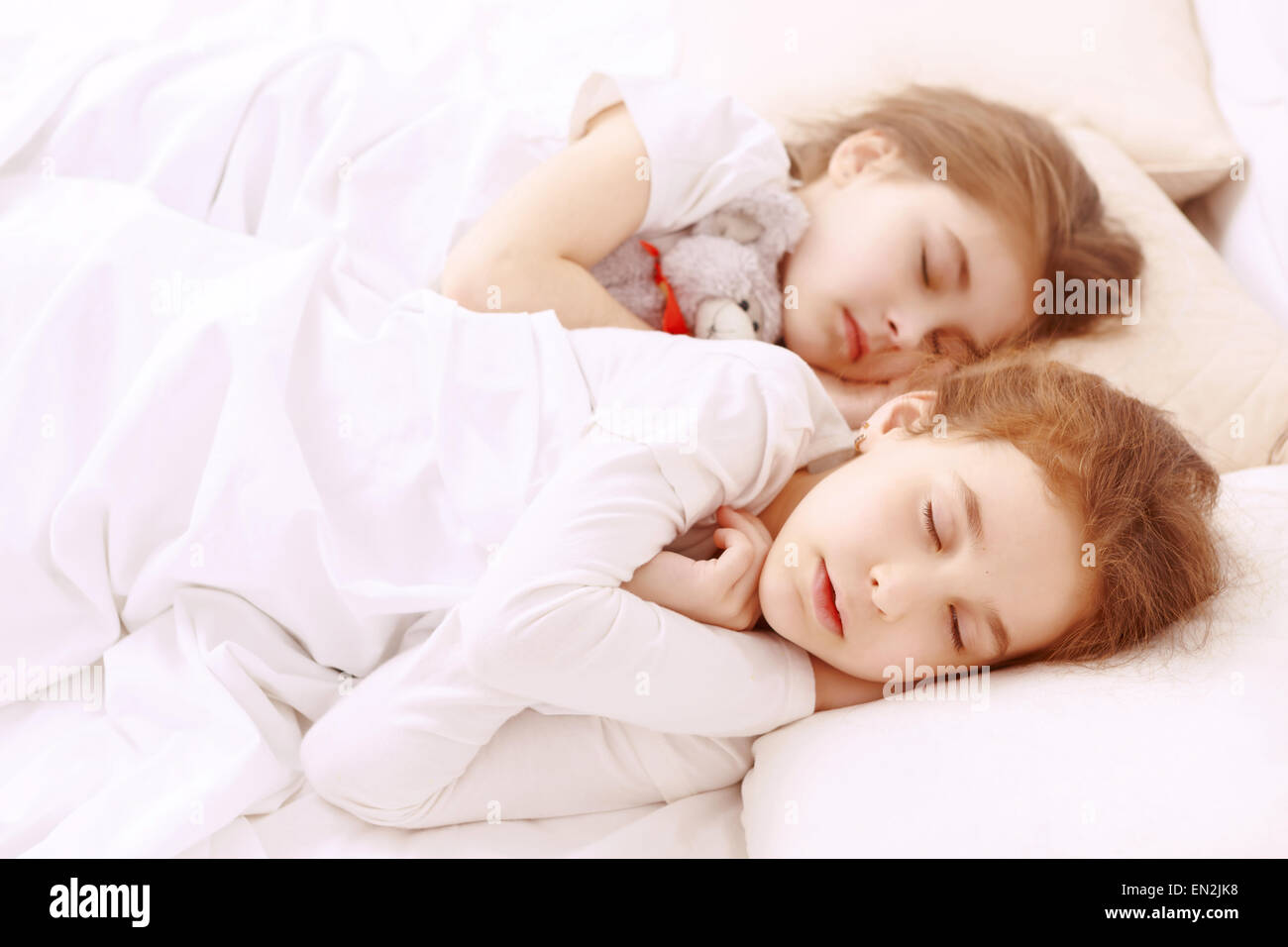 Two little cute sleeping girls Stock Photo - Alamy
