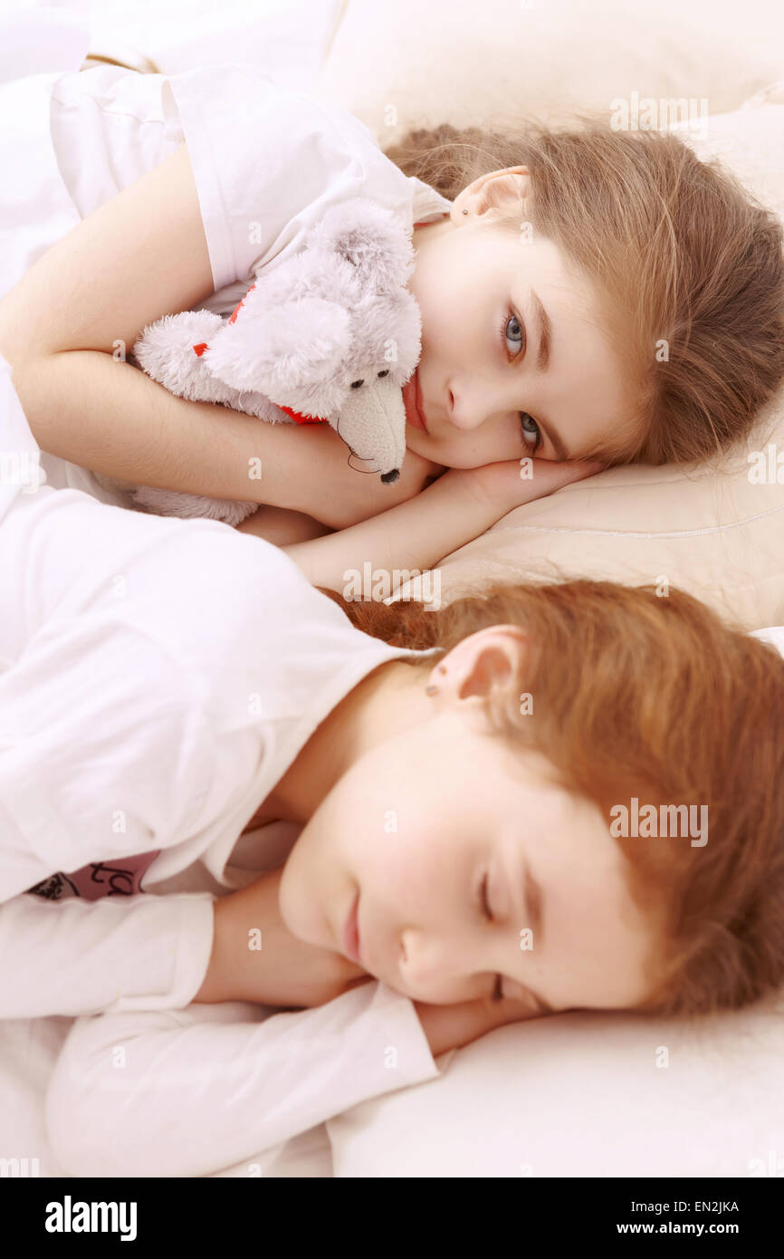 Two little cute sleeping girls Stock Photo - Alamy