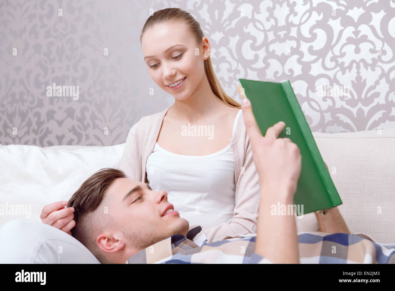 Two nice young people reading Stock Photo - Alamy