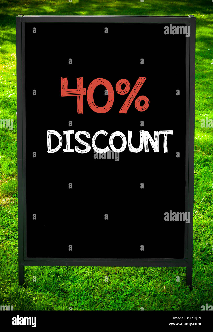 FOURTY PERCENT DISCOUNT message on sidewalk blackboard sign against ...