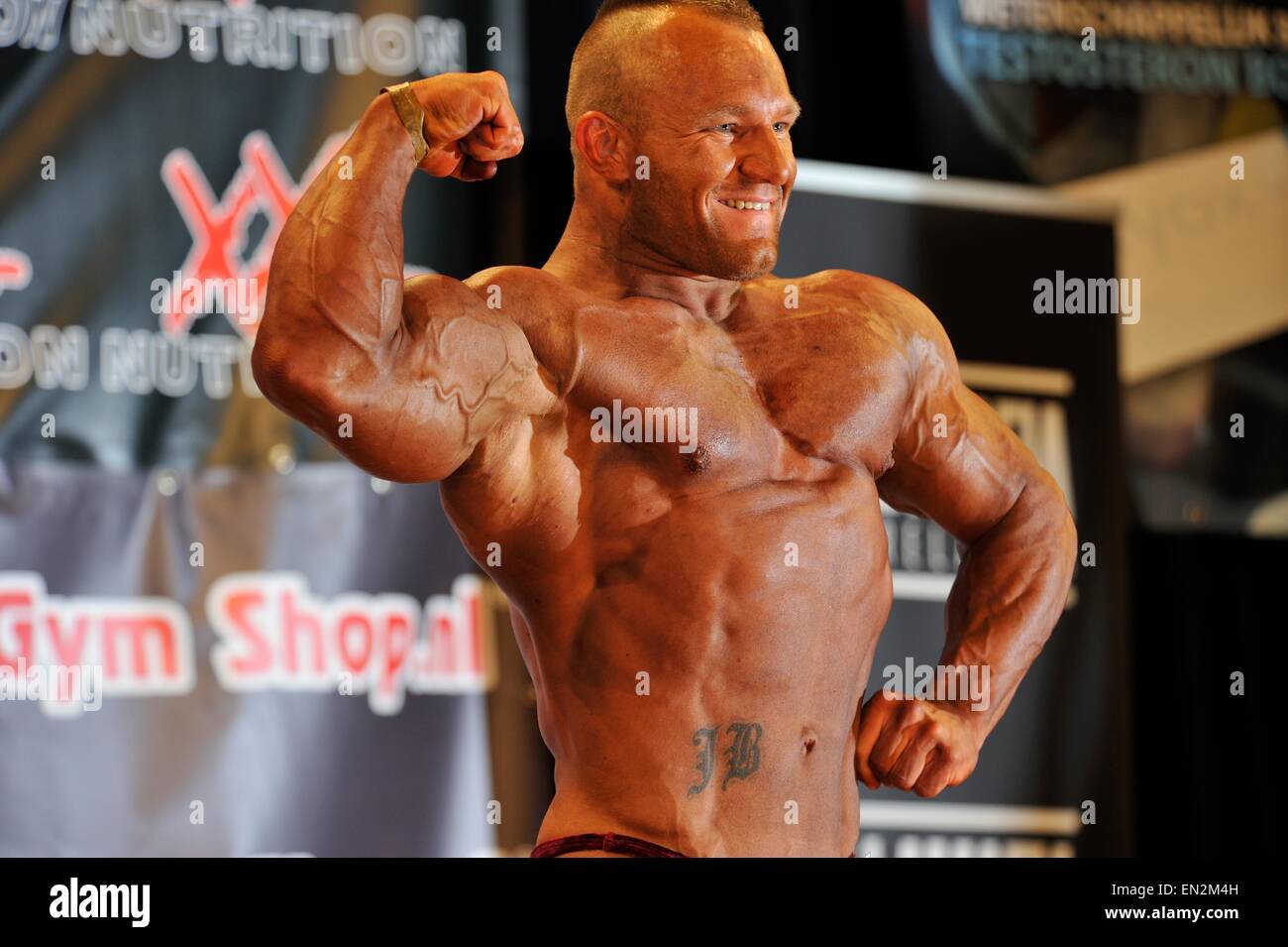 Schiedam, the Netherlands. 26th April, 2015. Male bodybuilder shows his ...