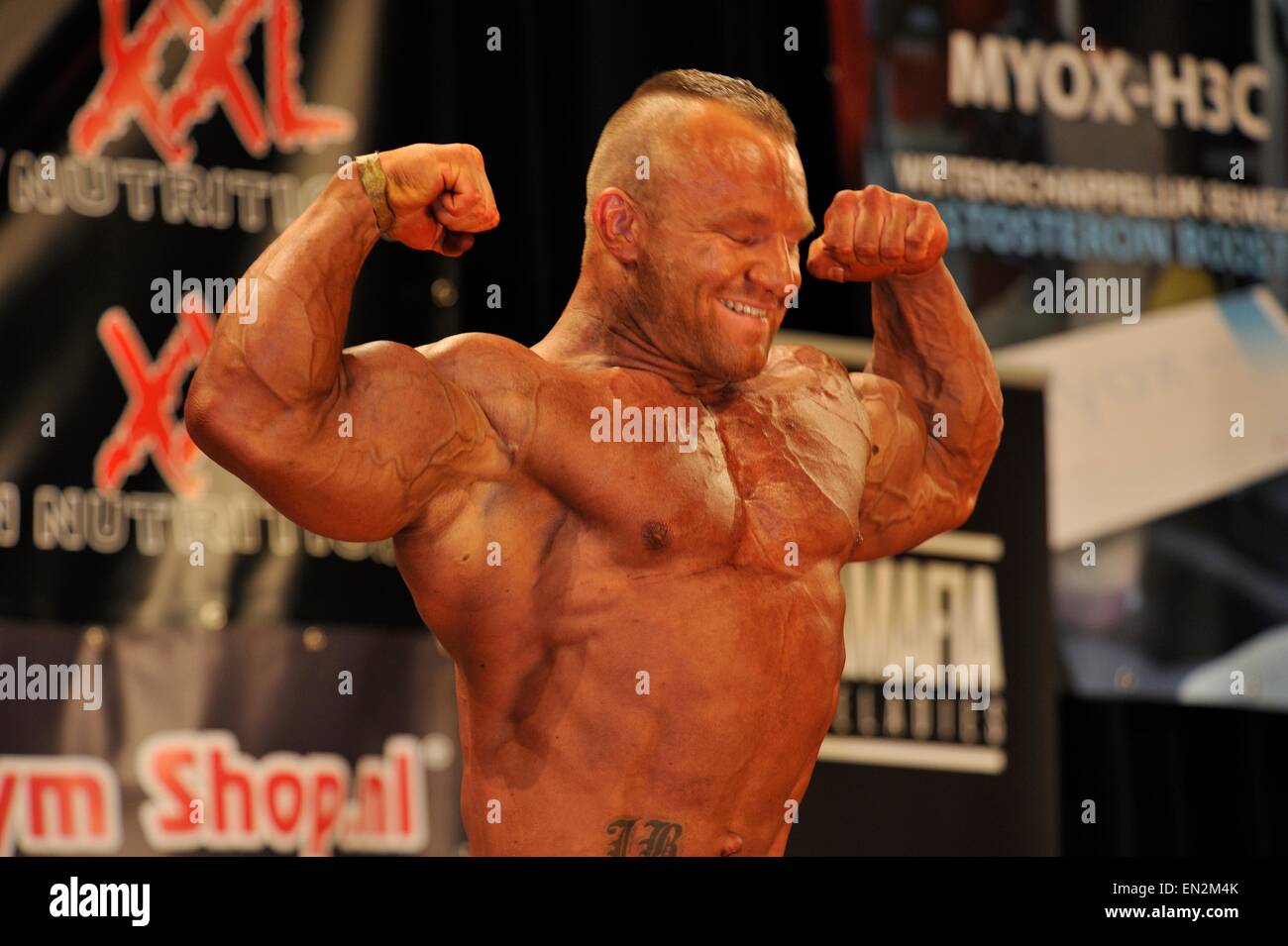 Schiedam, the Netherlands. 26th April, 2015. Male bodybuilder shows his ...