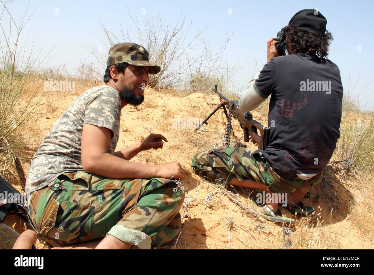 Sabratha, Libya. 26th Apr, 2015. A fighter for Libya Dawn reconnoiters ...