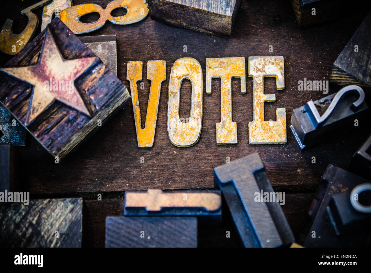 The word VOTE written in rusted metal letters surrounded by vintage ...