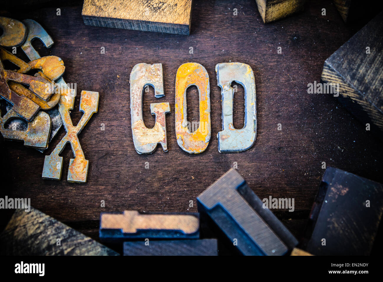 The word GOD written in rusted metal letters surrounded by vintage ...