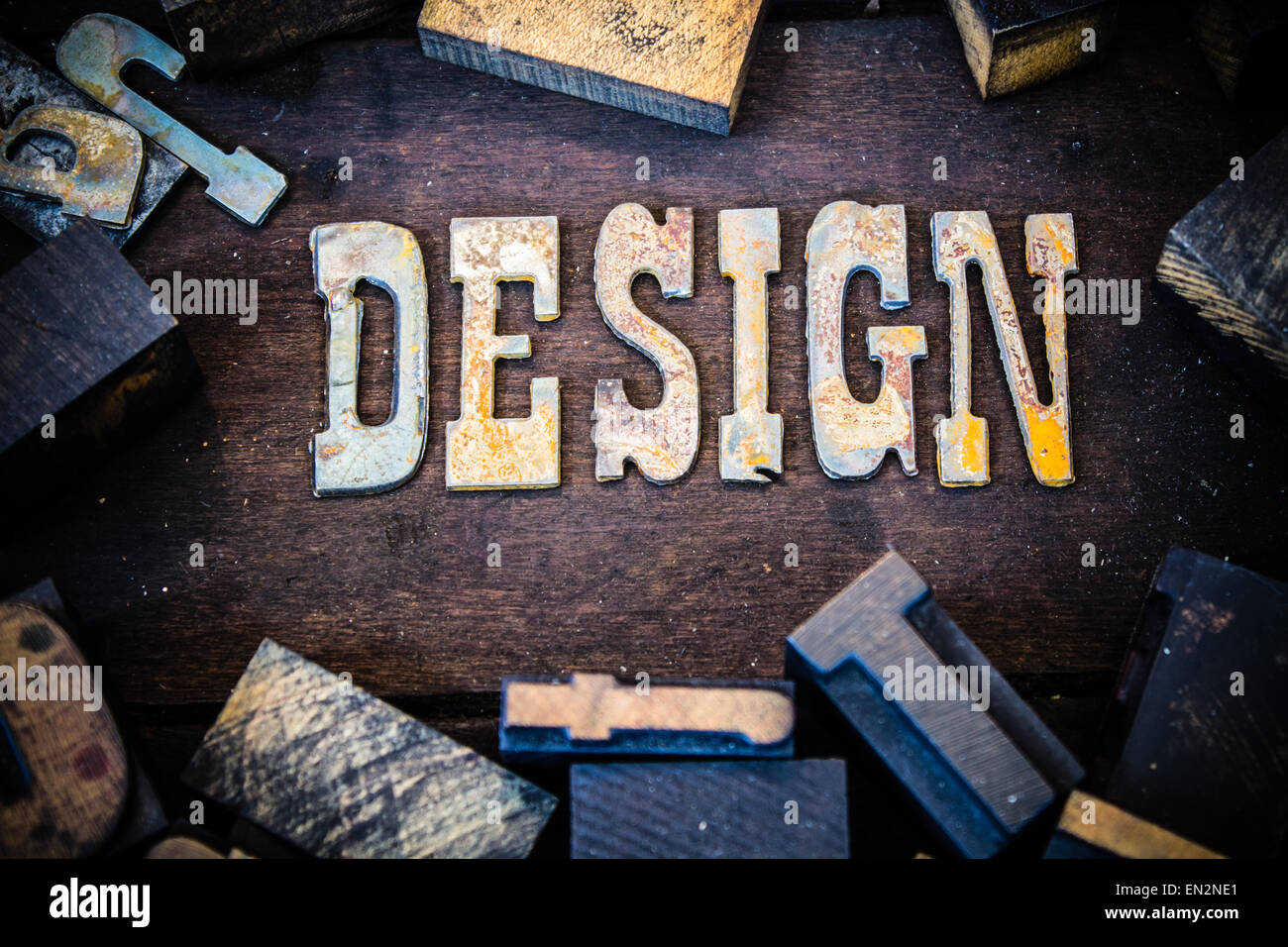 The word DESIGN written in rusted metal letters surrounded by vintage ...