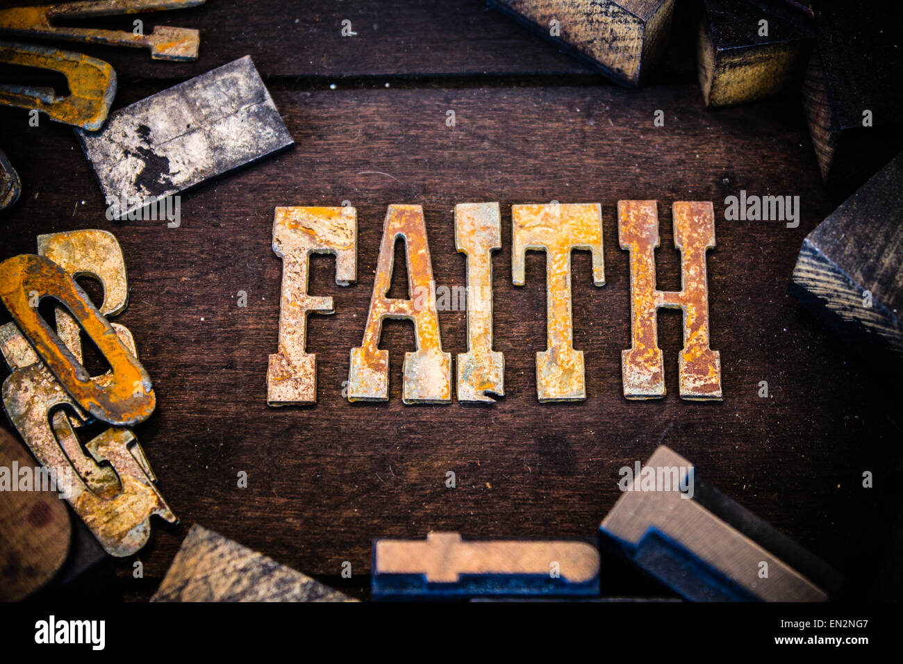 The word faith written in rusted metal letters surrounded by vintage ...