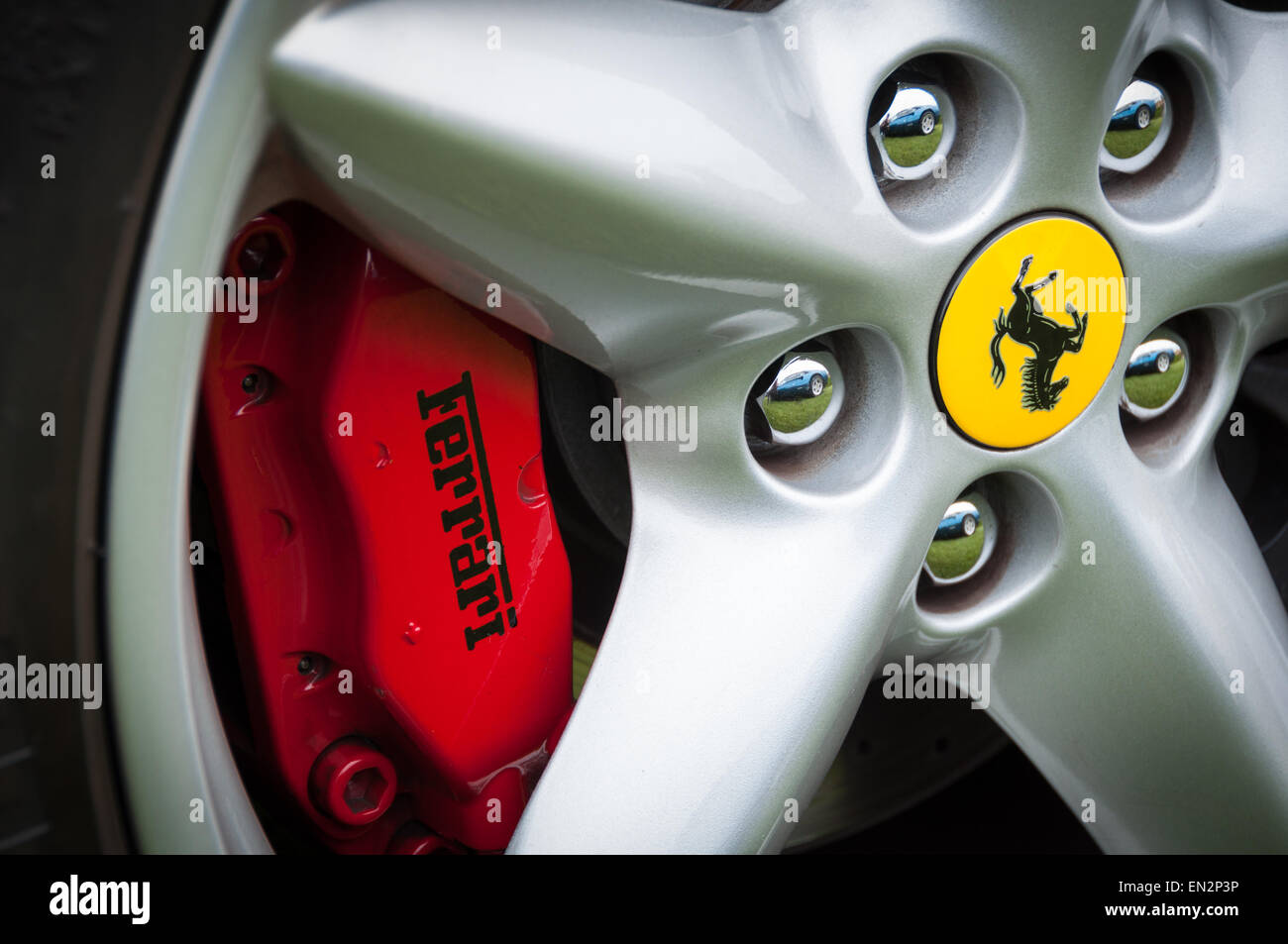 Detail of Ferrari wheel rim and red brake pad Stock Photo - Alamy