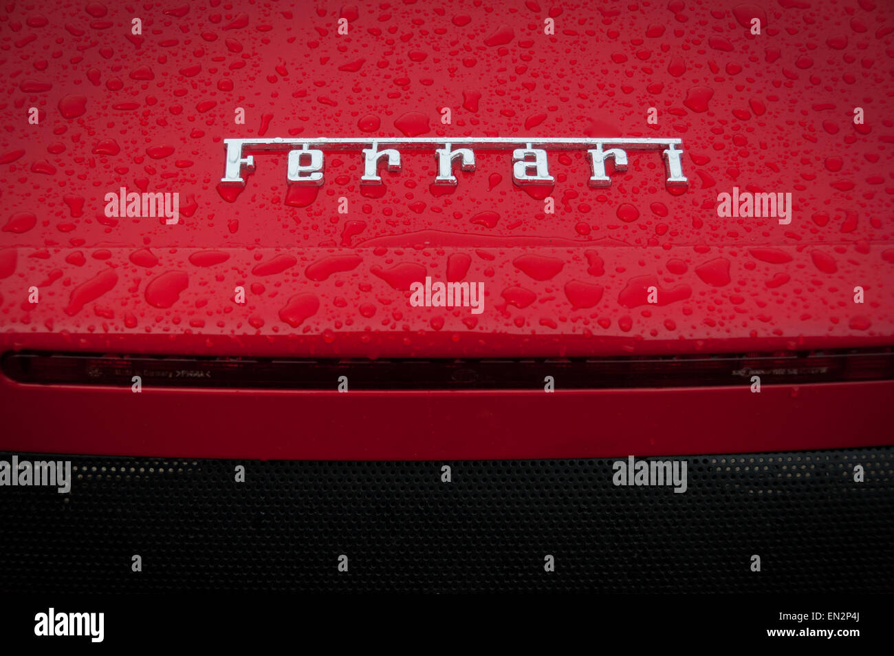 Red ferrari luxury cars badge on rear bonnet Stock Photo - Alamy