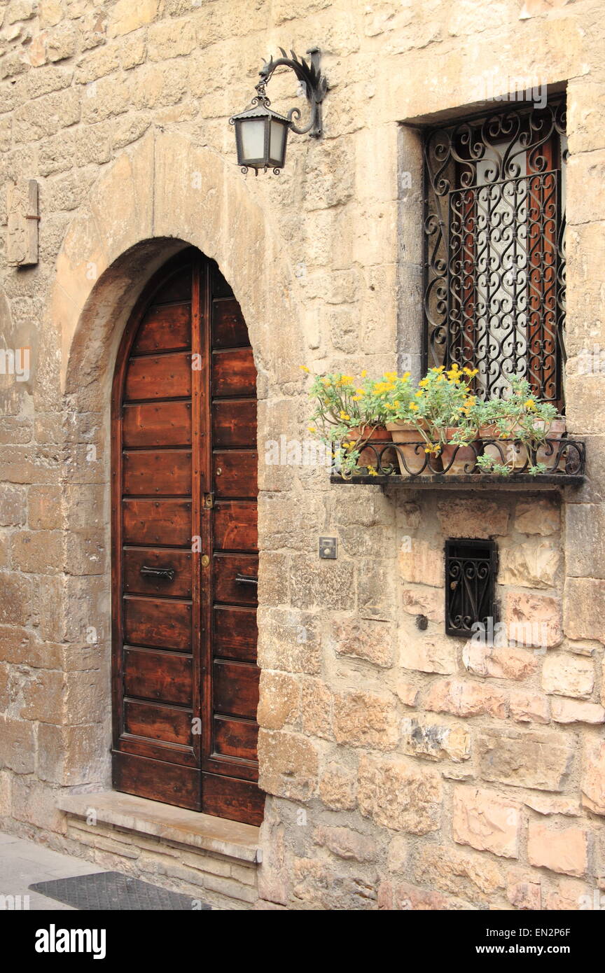 Medieval door with lamp, window and flower pots Stock Photo - Alamy