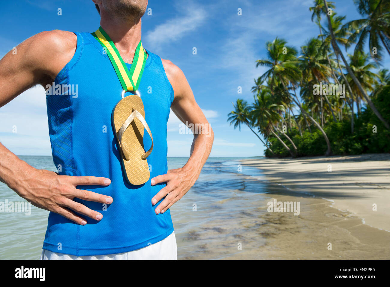 First place Brazilian athlete standing with flip flop gold medal on ...