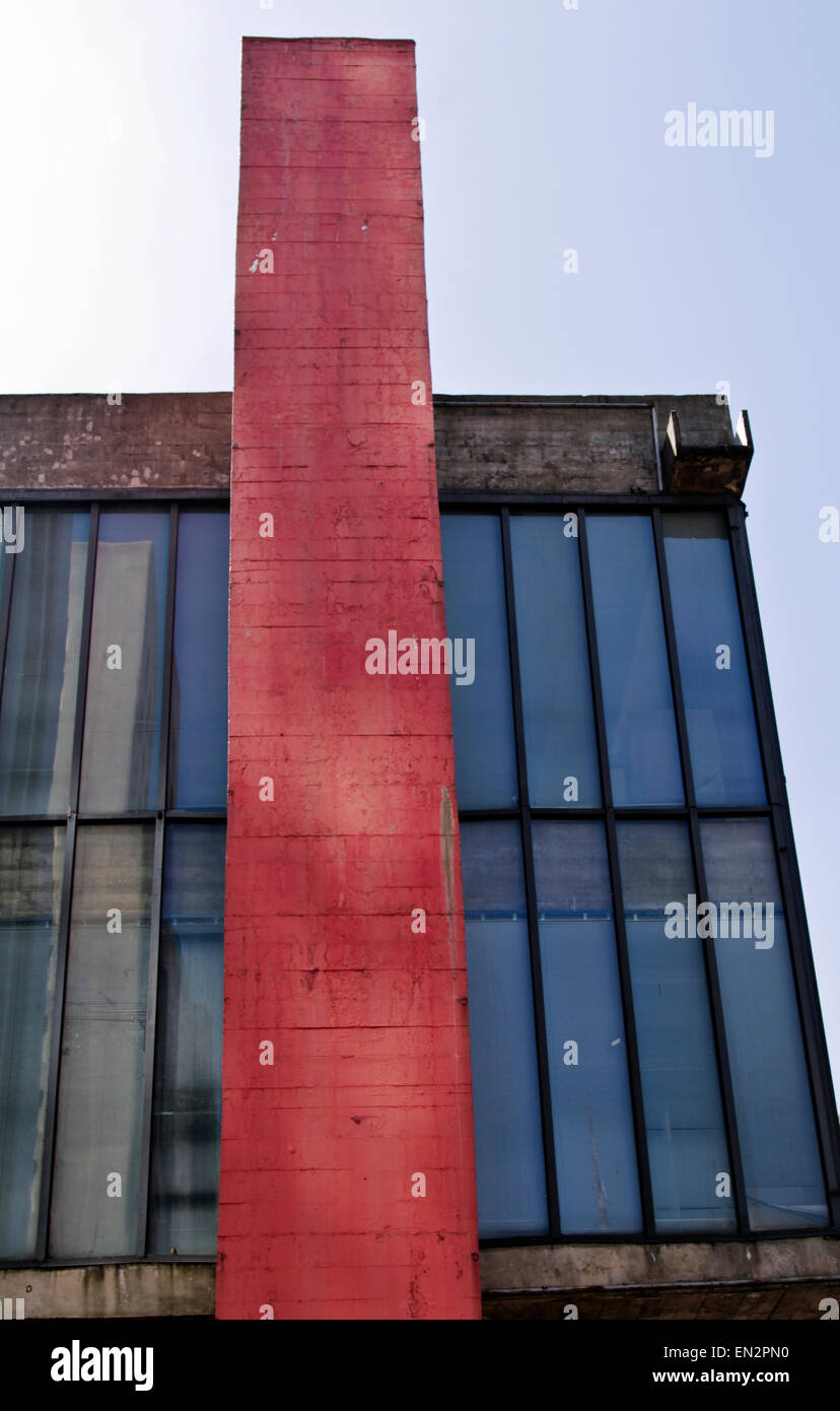 Modern building with glass facade in blue and red Stock Photo - Alamy