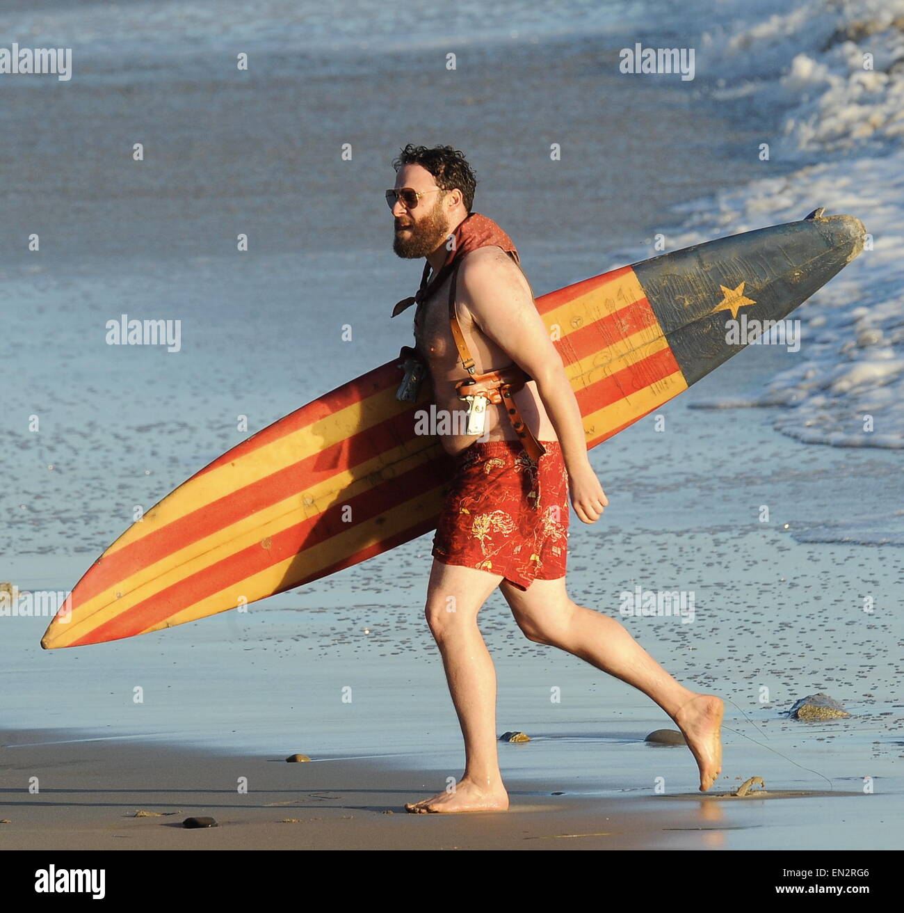 Actor Seth Rogen is lock and loaded on the beach and ready to surf for ...