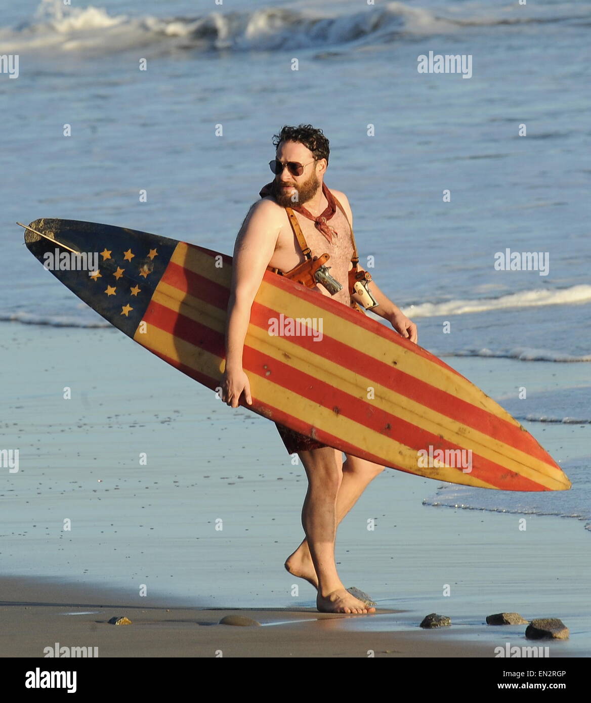 Actor Seth Rogen is lock and loaded on the beach and ready to surf for ...