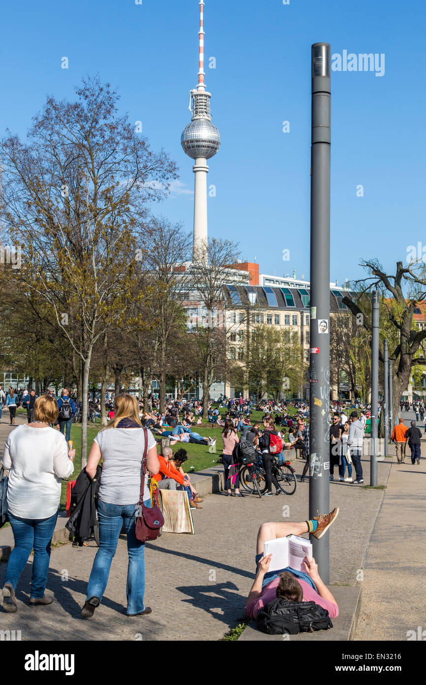 James Simon Park, along river Spree, people enjoying the spring sun in ...