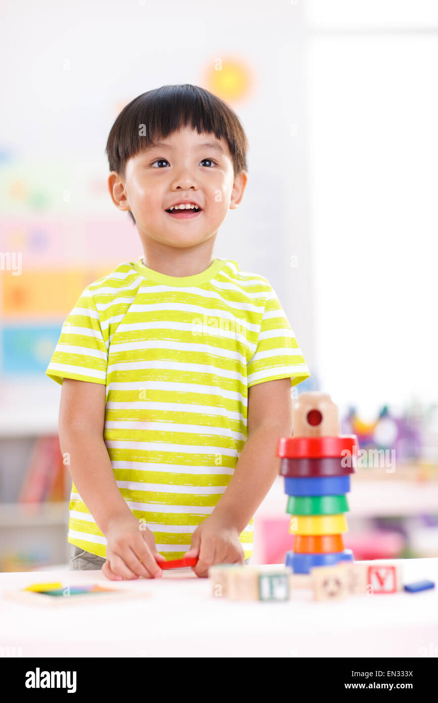 Kindergarten children playing in the recreation room Stock Photo - Alamy