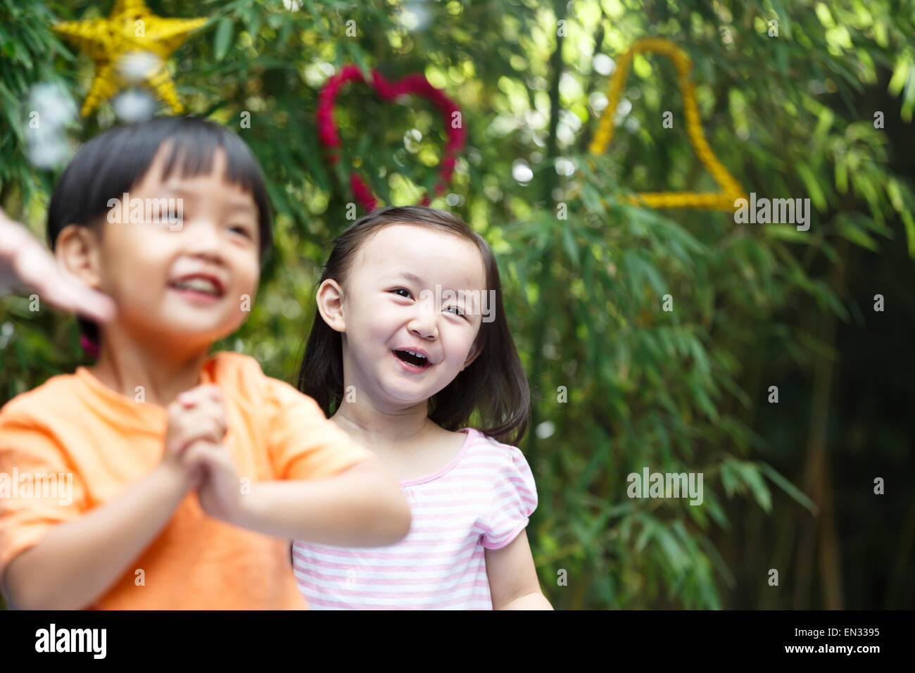 Lovely children are playing outside Stock Photo - Alamy