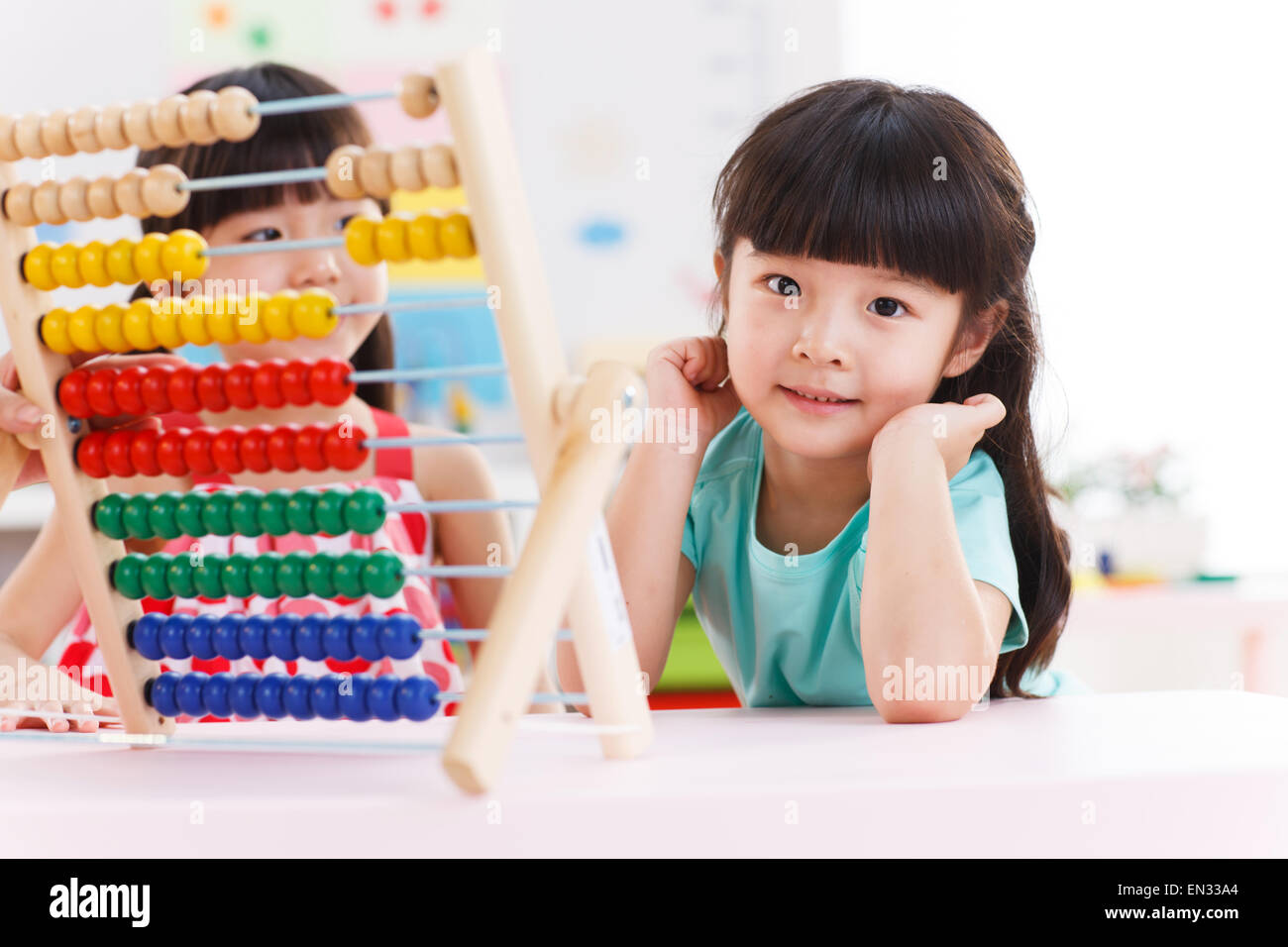 Cute little girl in the kindergarten Stock Photo - Alamy