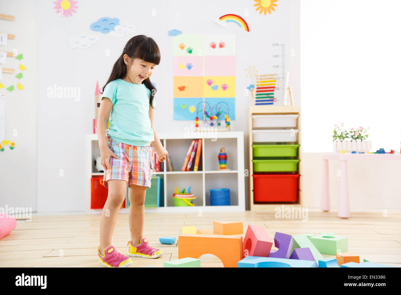Kindergarten children playing in the recreation room Stock Photo - Alamy