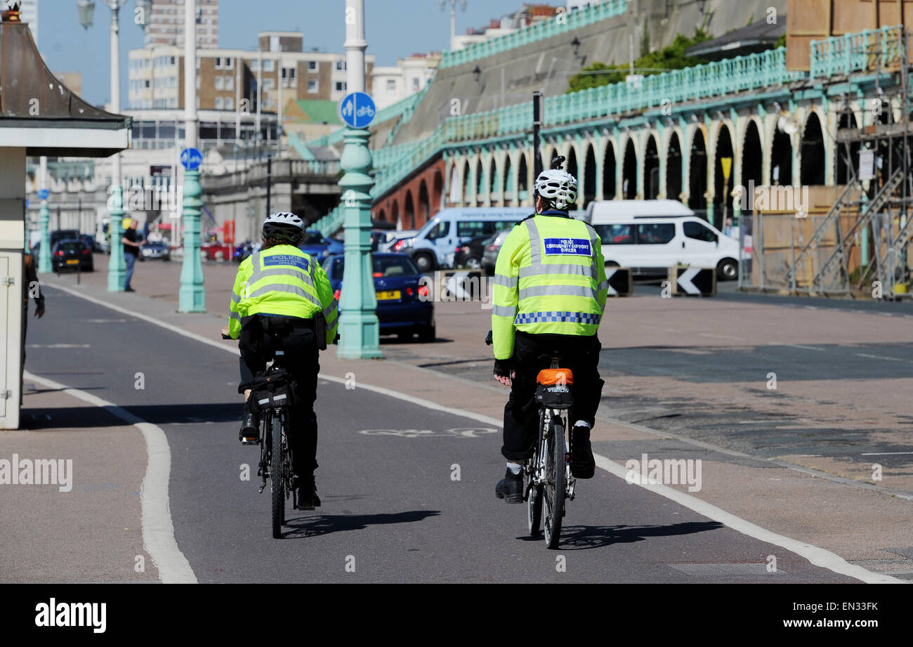Two Police Community Support Officers cycling along Brighton seafront ...