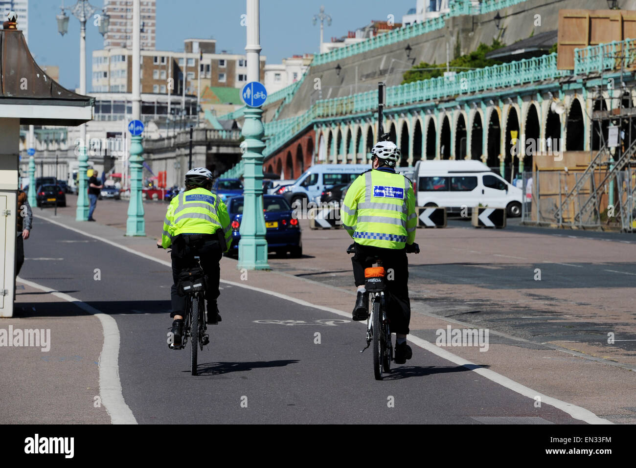 Two Police Community Support Officers cycling along Brighton seafront ...