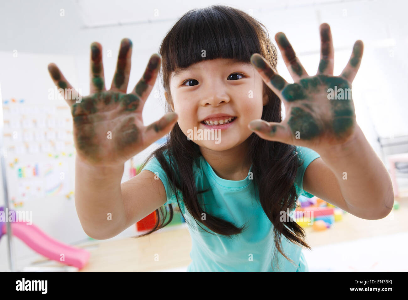 A lovely little girl hand full of pigment Stock Photo - Alamy